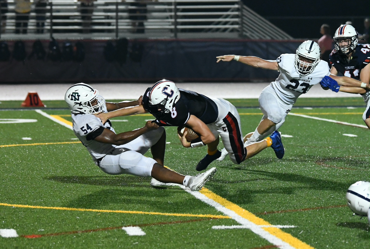New Trier survives road test against Conant behind five rushing ...
